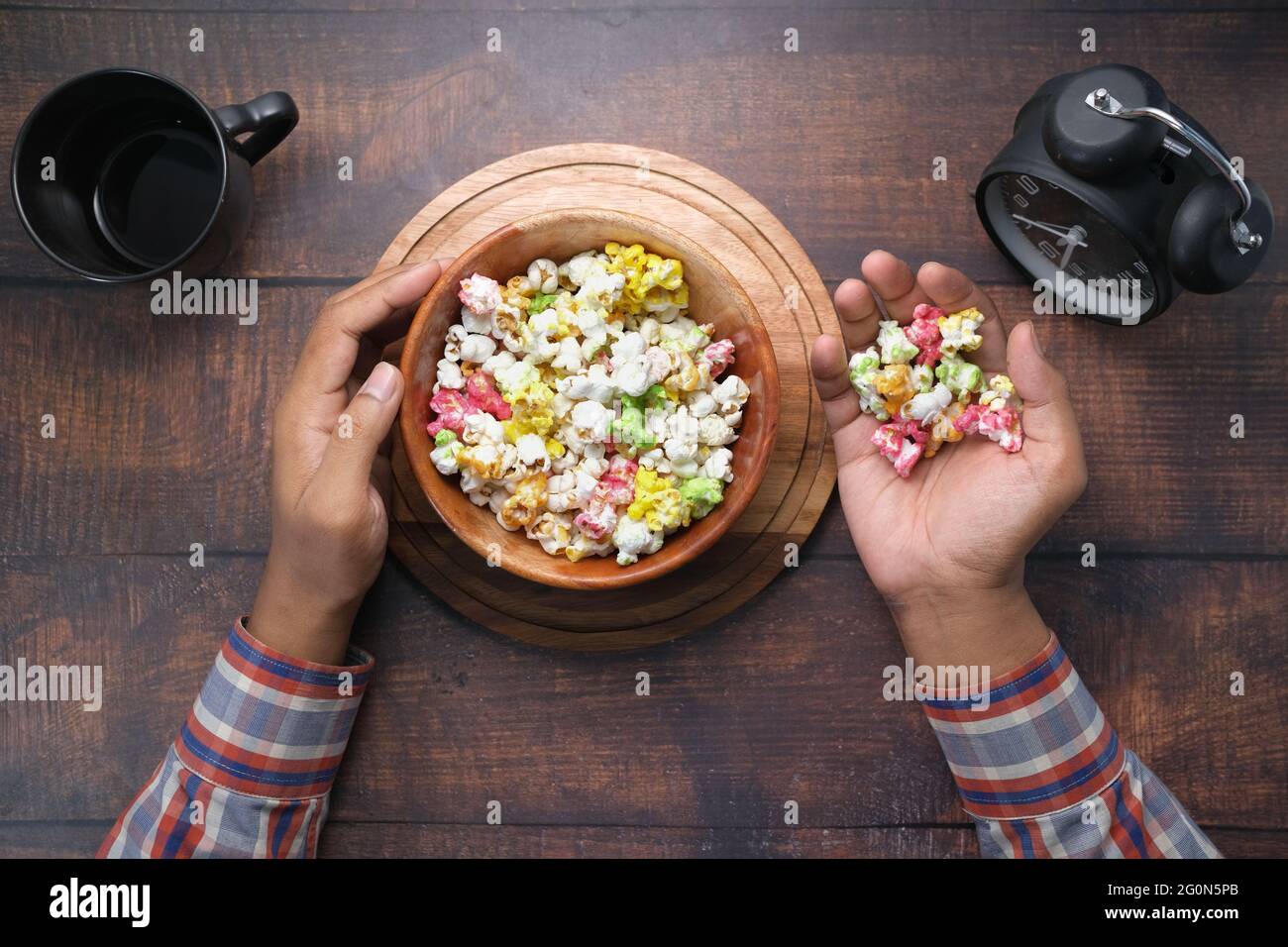young man eating popcorn top view Stock Photo - Alamy