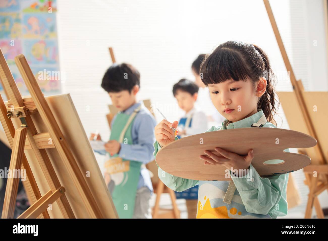 Easel paint children hi-res stock photography and images - Alamy