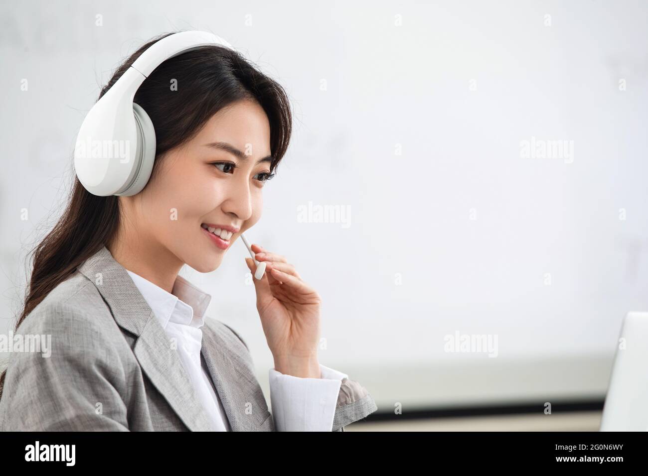 Young women wearing headphones Stock Photo - Alamy