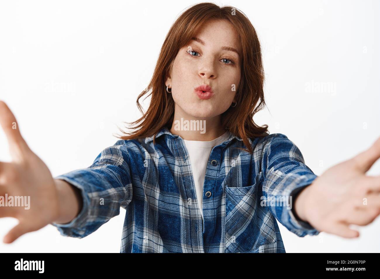 Tender and cute redhead woman kissing you, reaching hands to hold and ...