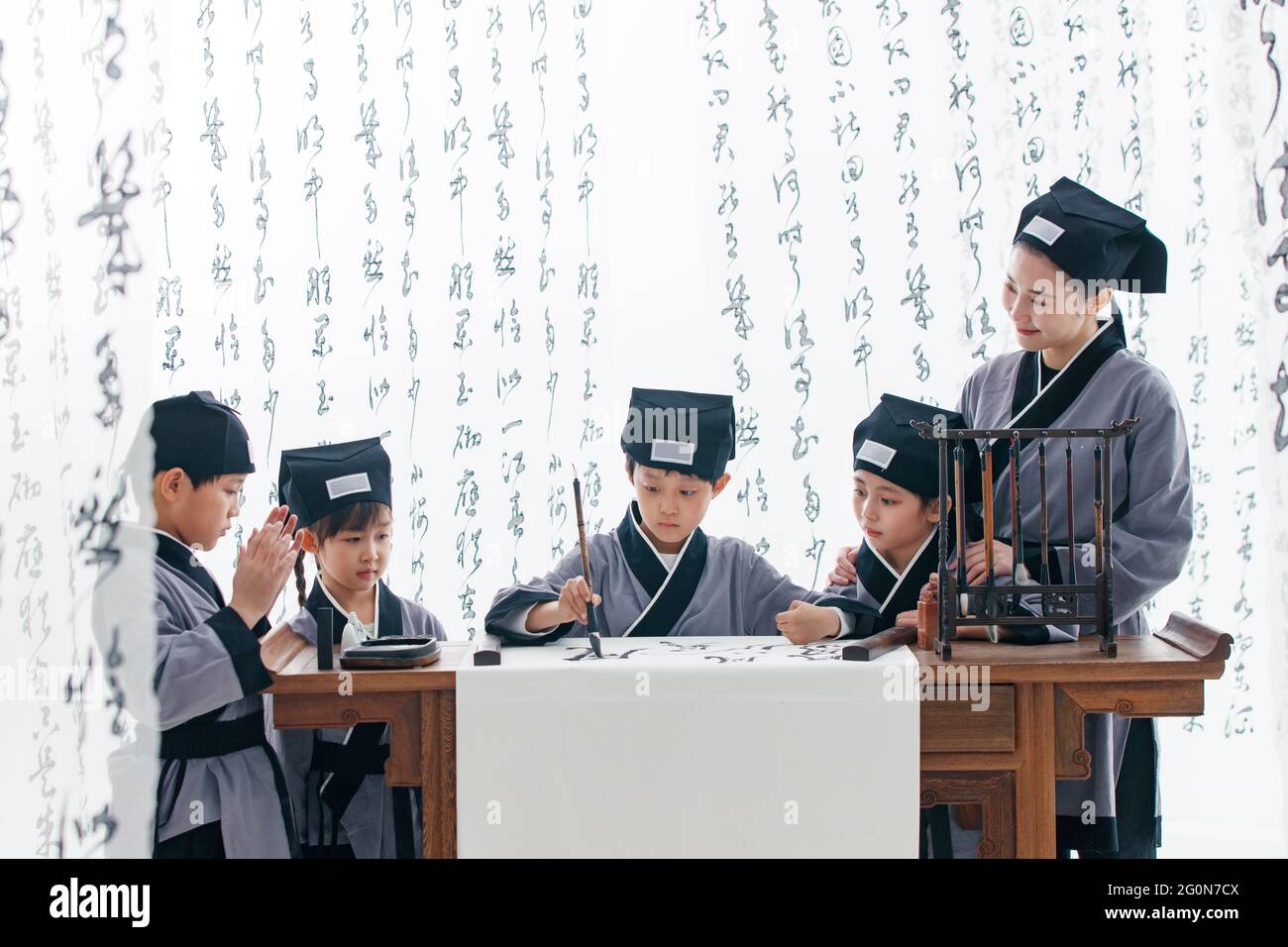 The teacher taught the pupils to learn calligraphy Stock Photo - Alamy