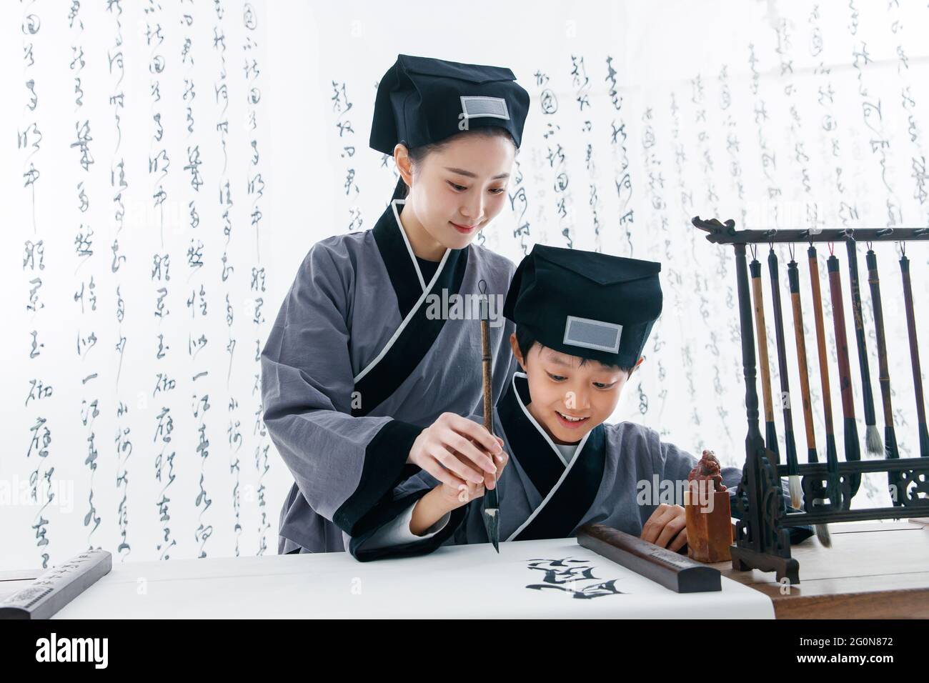 The teacher taught the pupils to learn calligraphy Stock Photo - Alamy
