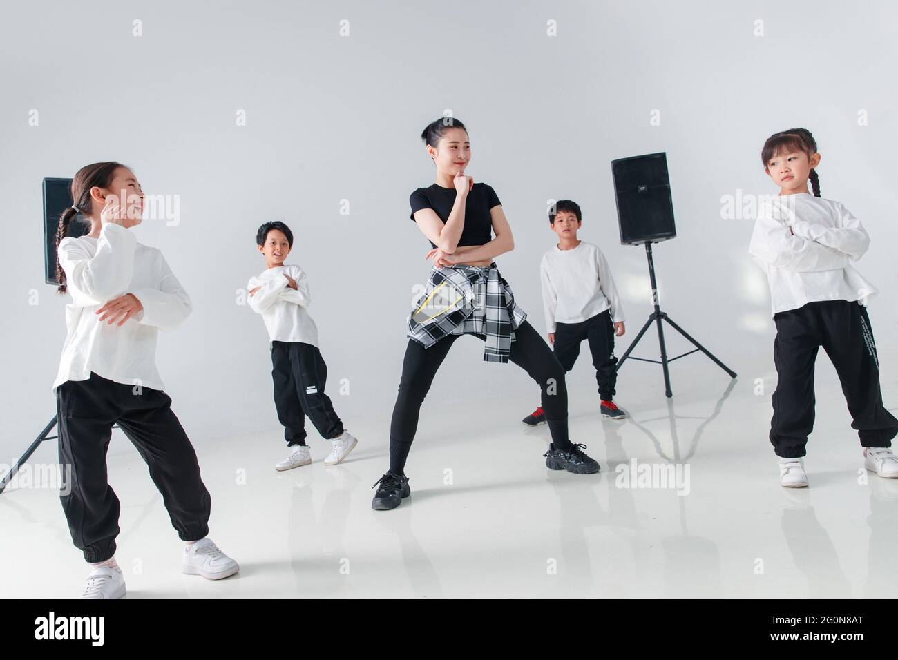 Dance teacher to teach the children learn how to dance Stock Photo - Alamy