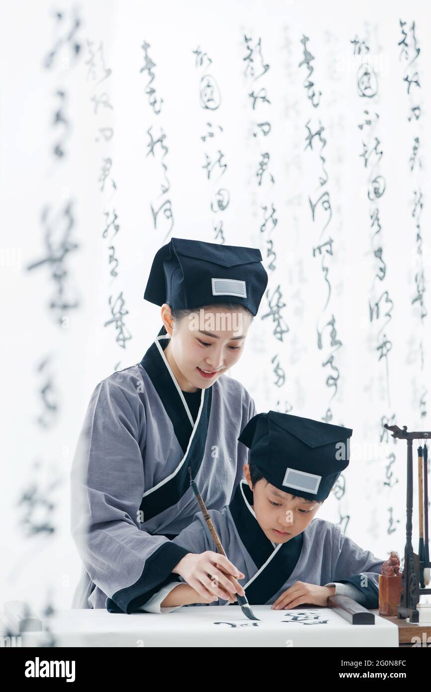 The teacher taught the pupils to learn calligraphy Stock Photo - Alamy