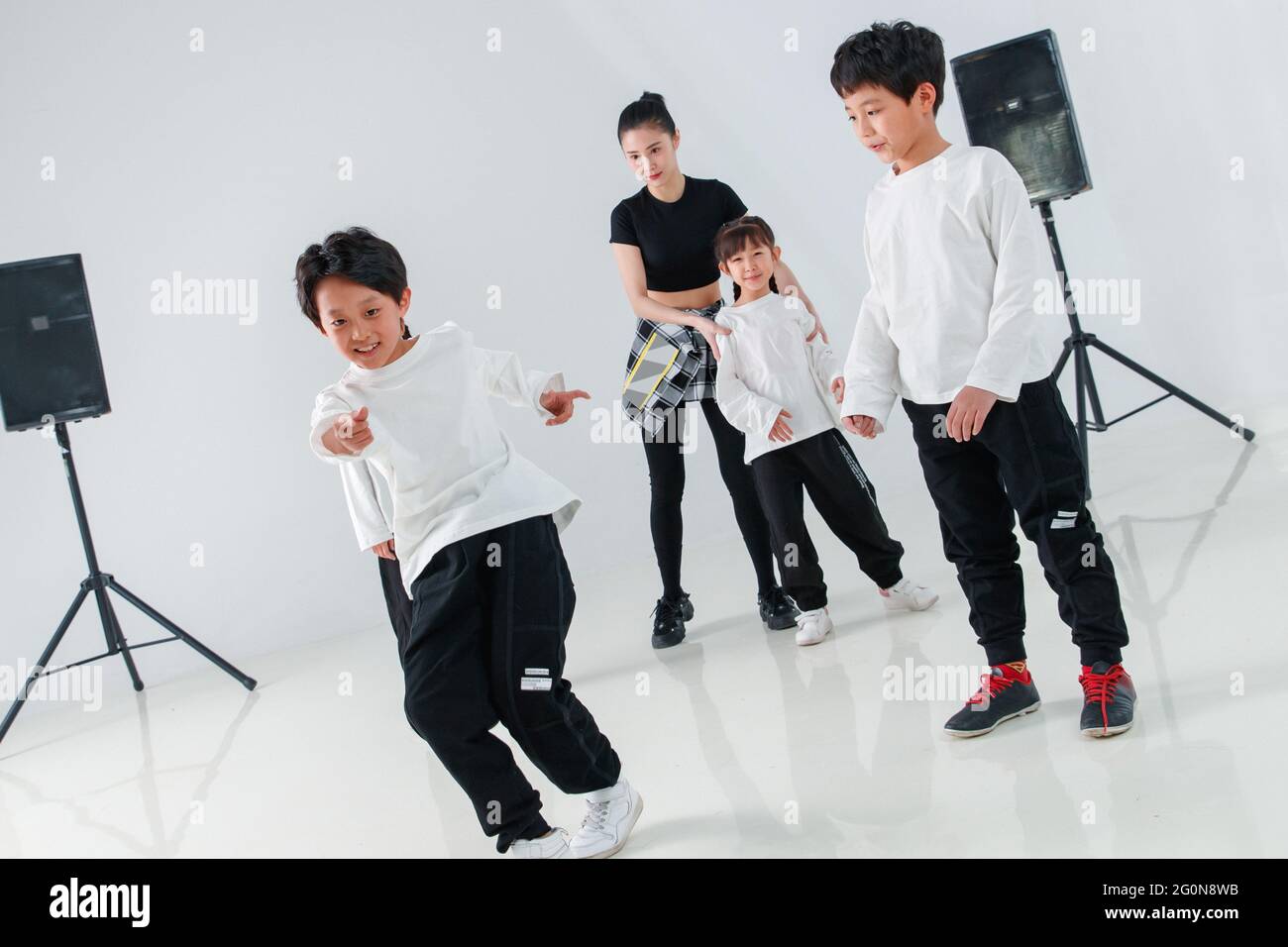 Happy pupils learn how to dance Stock Photo - Alamy