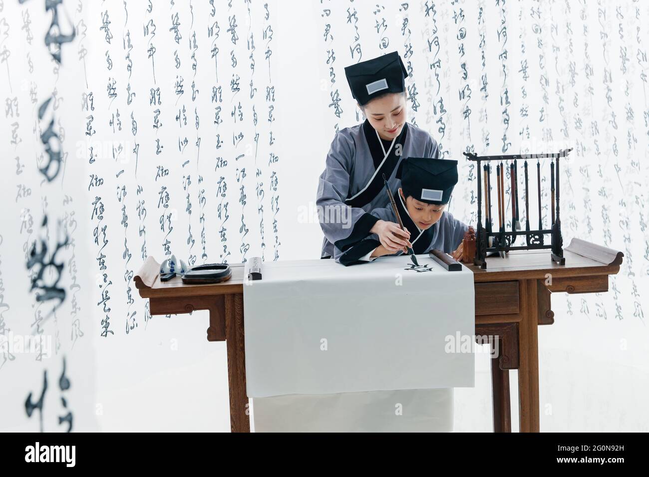 The teacher taught the pupils to learn calligraphy Stock Photo - Alamy