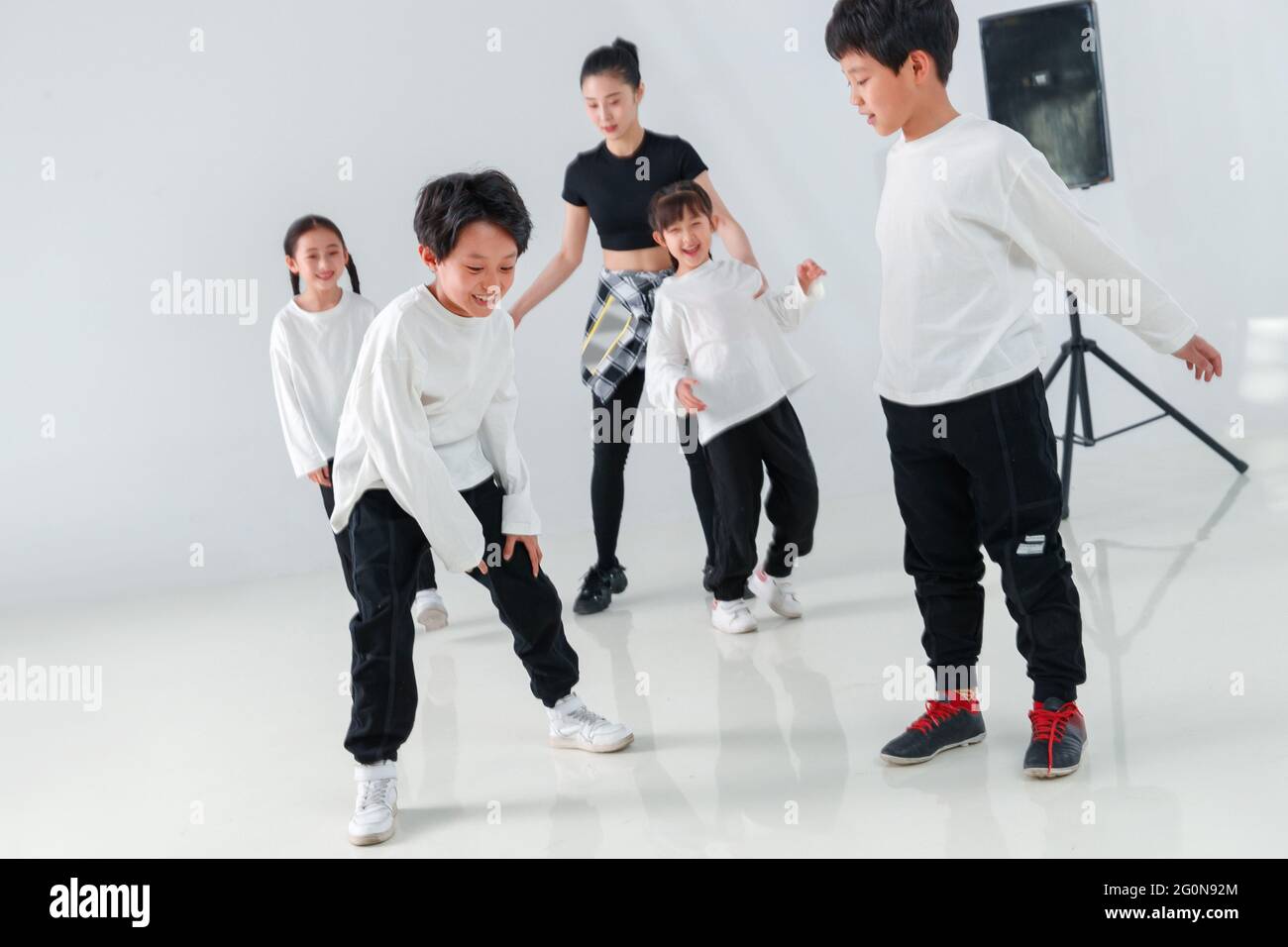 Happy pupils learn how to dance Stock Photo - Alamy