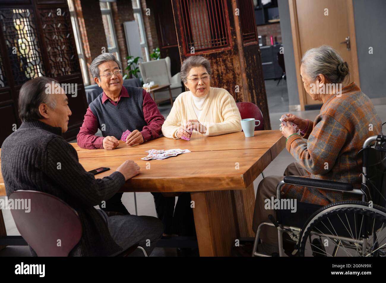 Old friends playing CARDS Stock Photo - Alamy