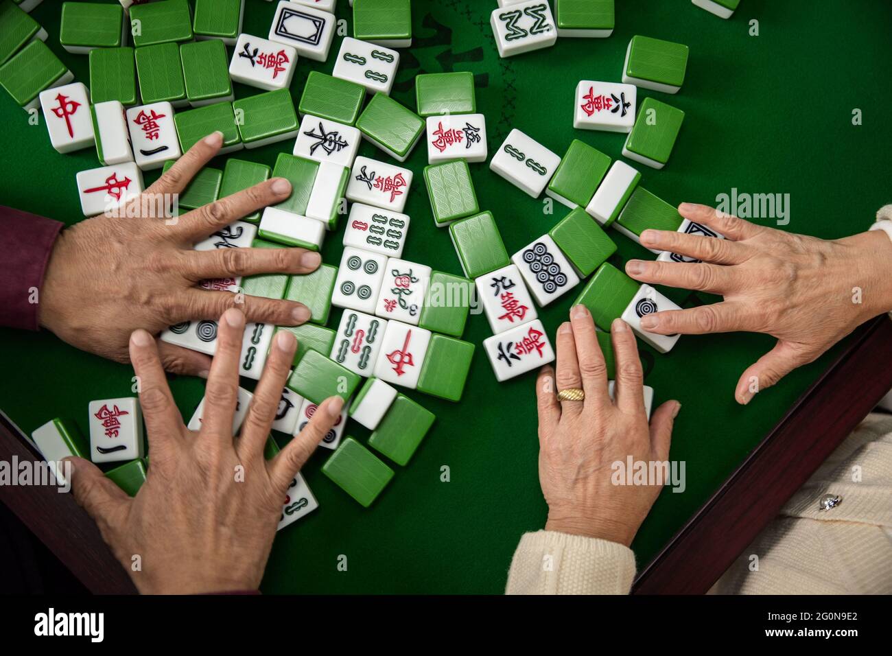 Old people playing mahjong Stock Photo - Alamy