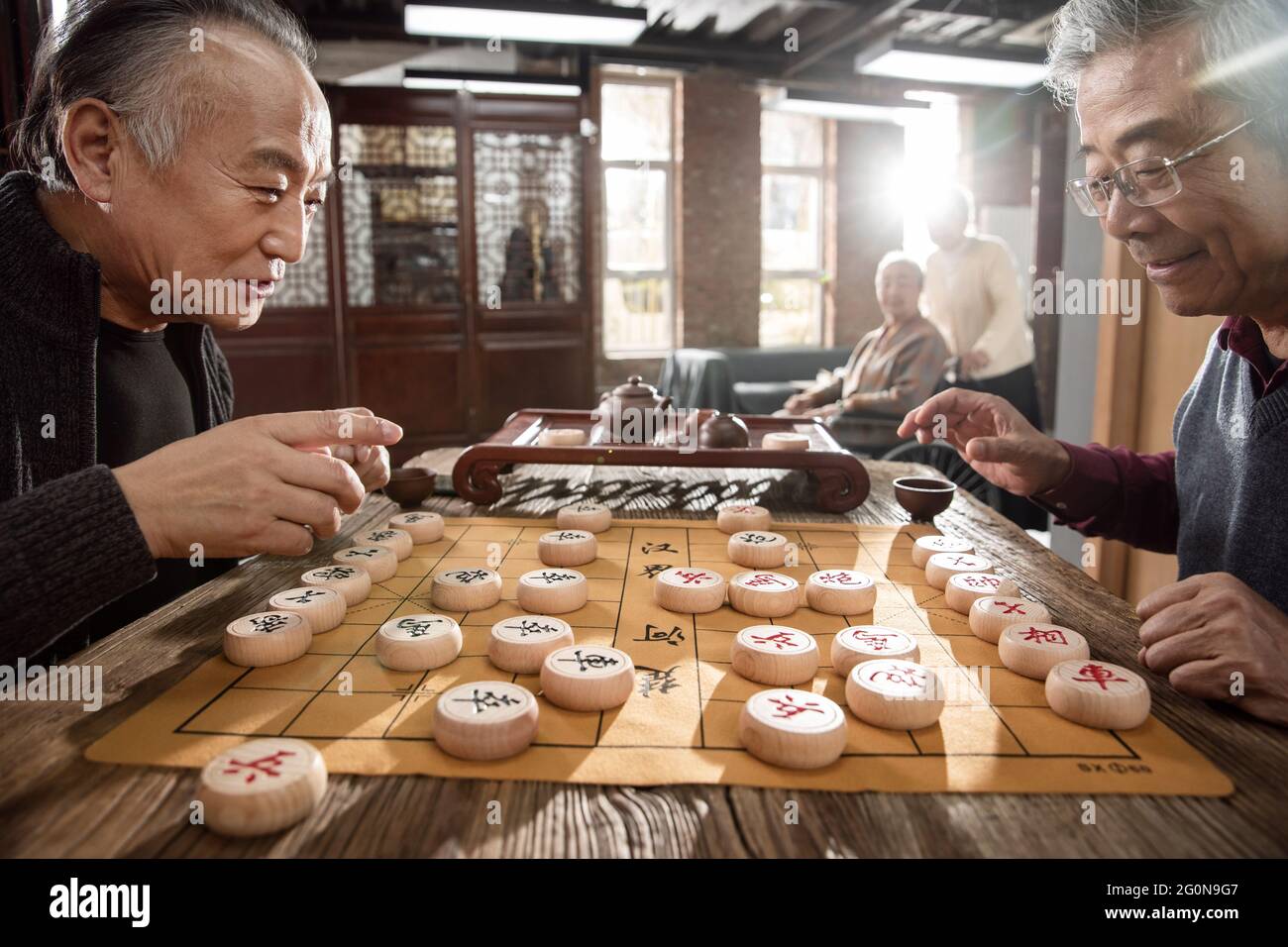 Old friends playing chess Stock Photo - Alamy