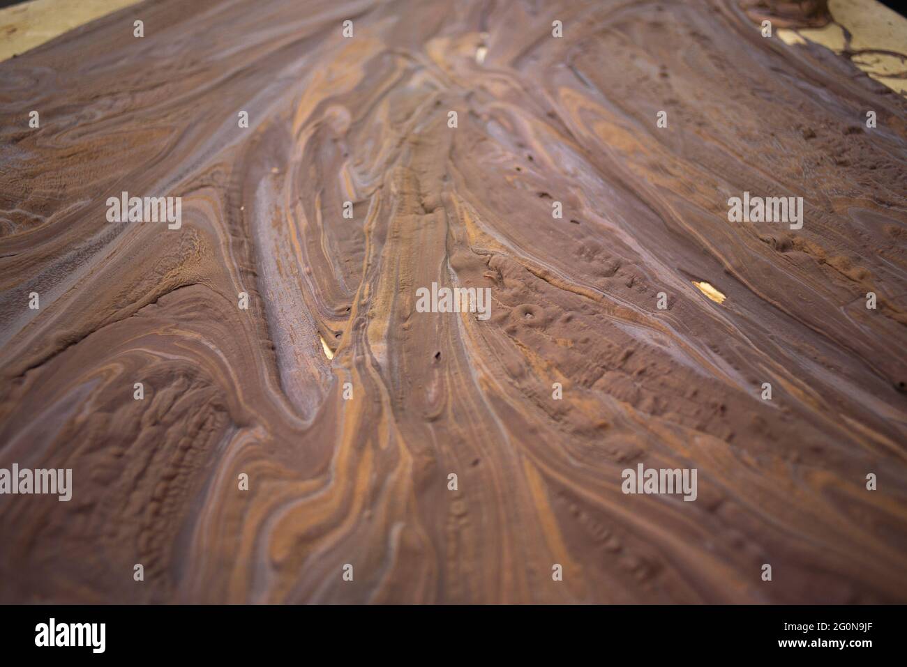 chocolate paste chilling on a table, stone shaped mexican artisan ...