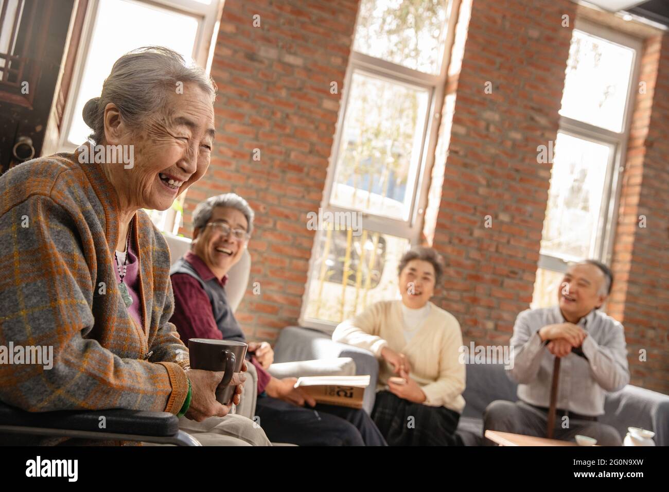 Happy old people come together to chat Stock Photo - Alamy