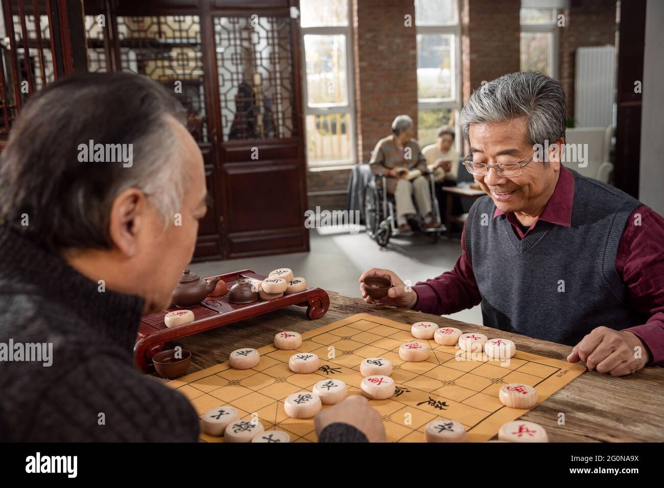 Old friends playing chess Stock Photo - Alamy