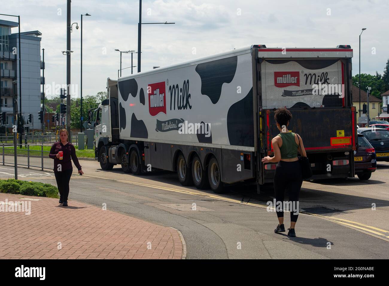 Slough, Berkshire, UK. 2nd June, 2021. Two girls out walking pass a ...