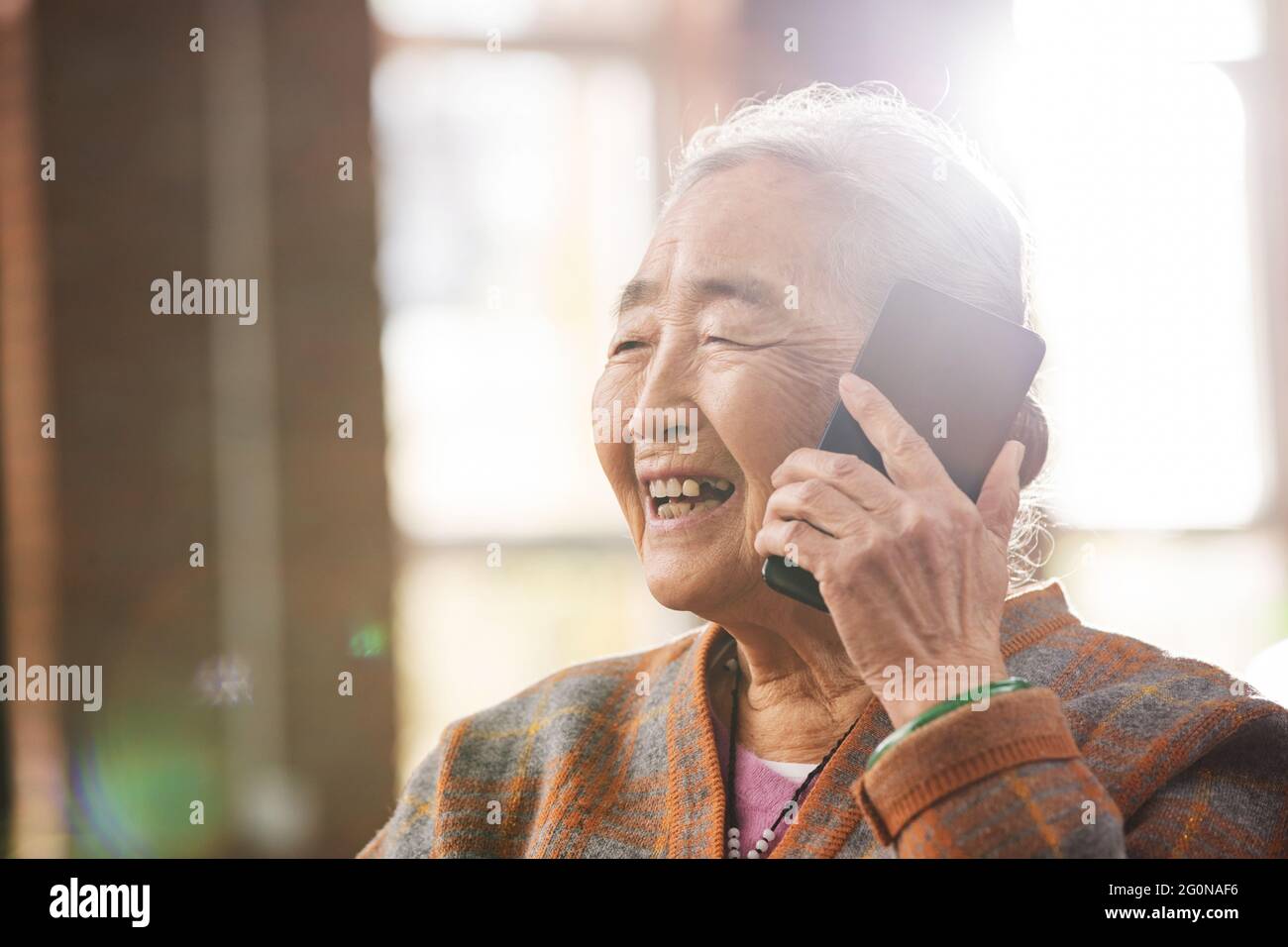 The elderly using a mobile phone call Stock Photo - Alamy