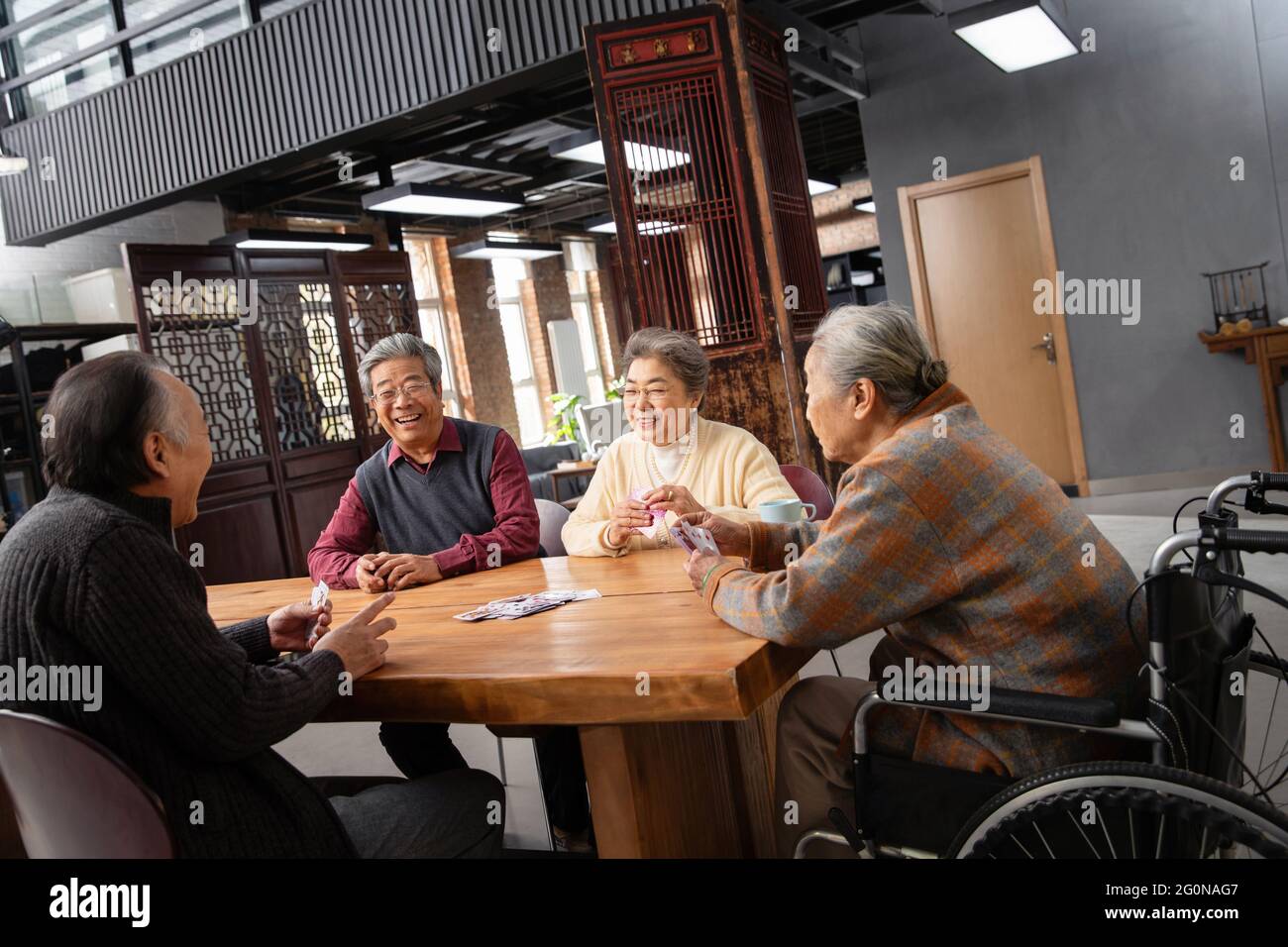 Old friends playing CARDS Stock Photo - Alamy