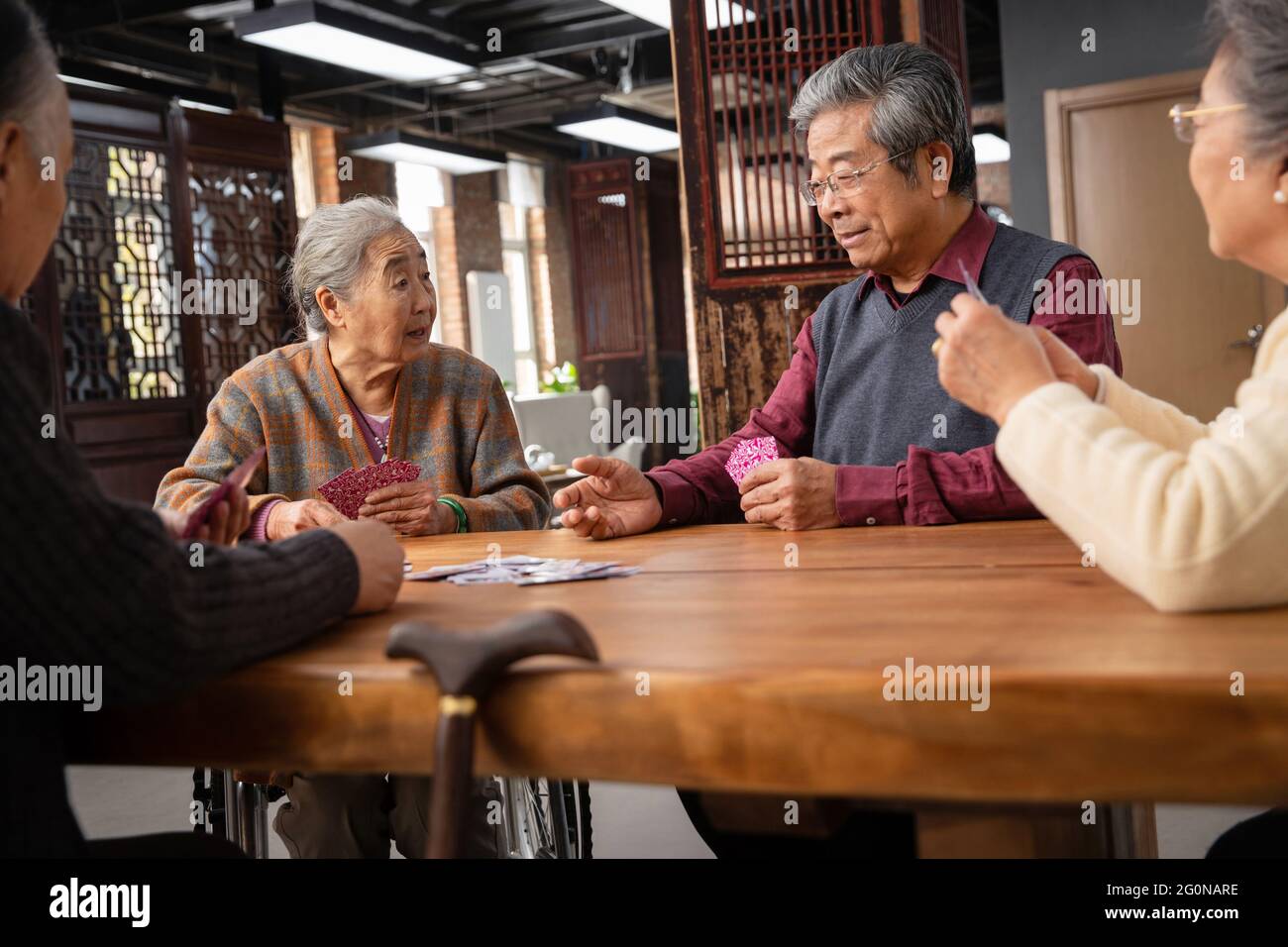 Old friends playing CARDS Stock Photo - Alamy
