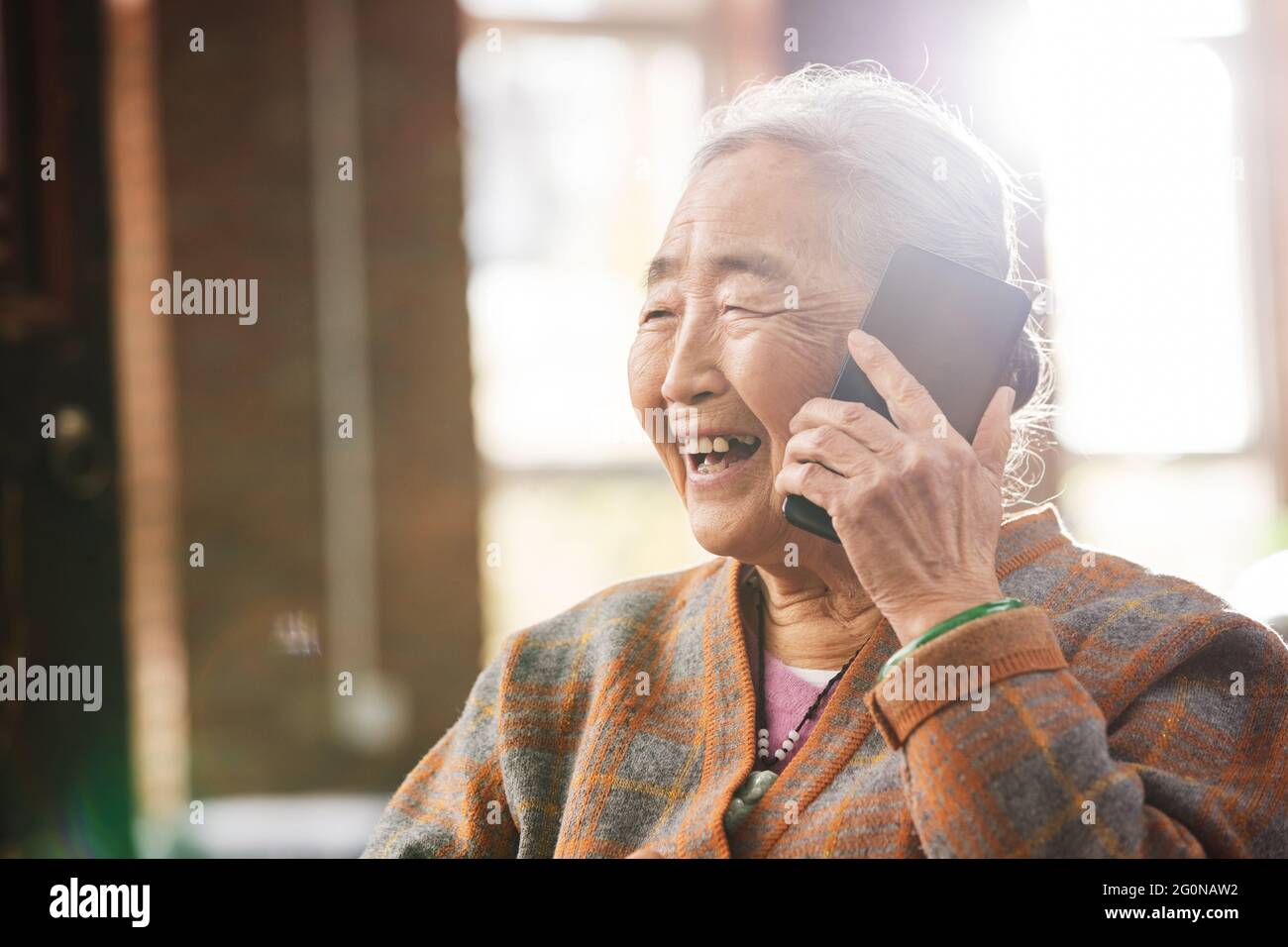 The elderly using a mobile phone call Stock Photo - Alamy