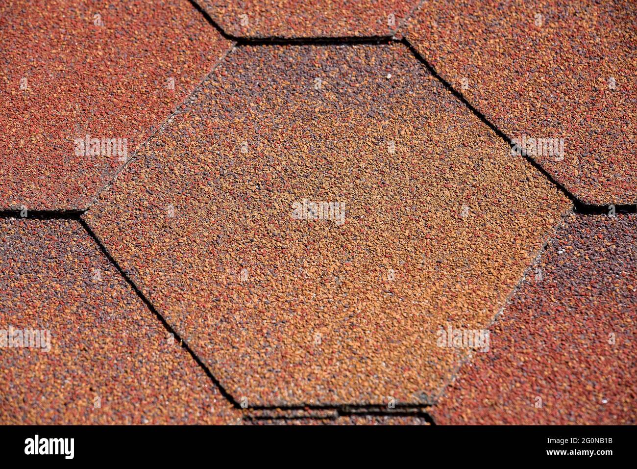 protective covering of roof with bitumen shingles of hexagonal shape closeup front view texture ...