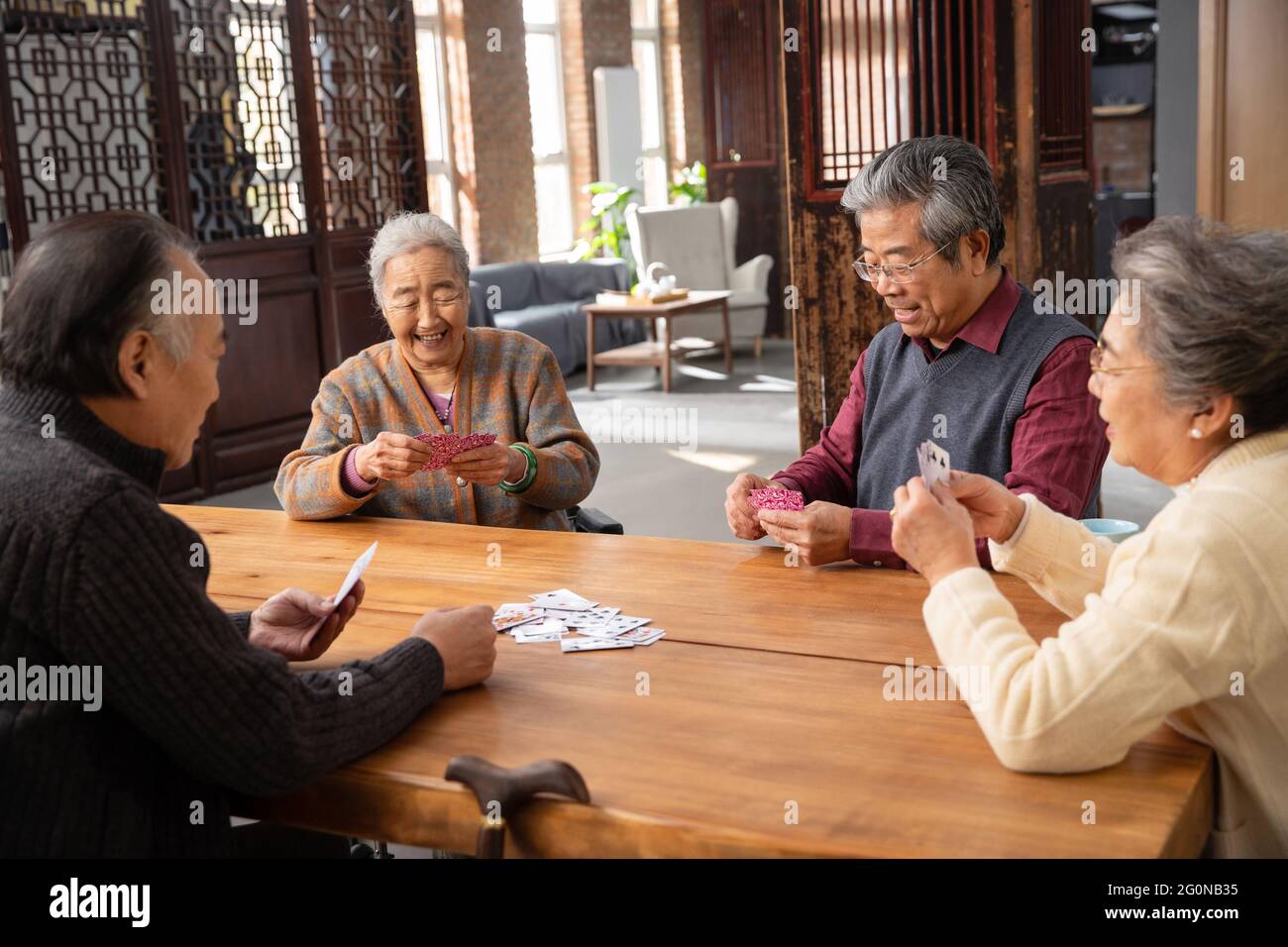 Old friends playing CARDS Stock Photo - Alamy