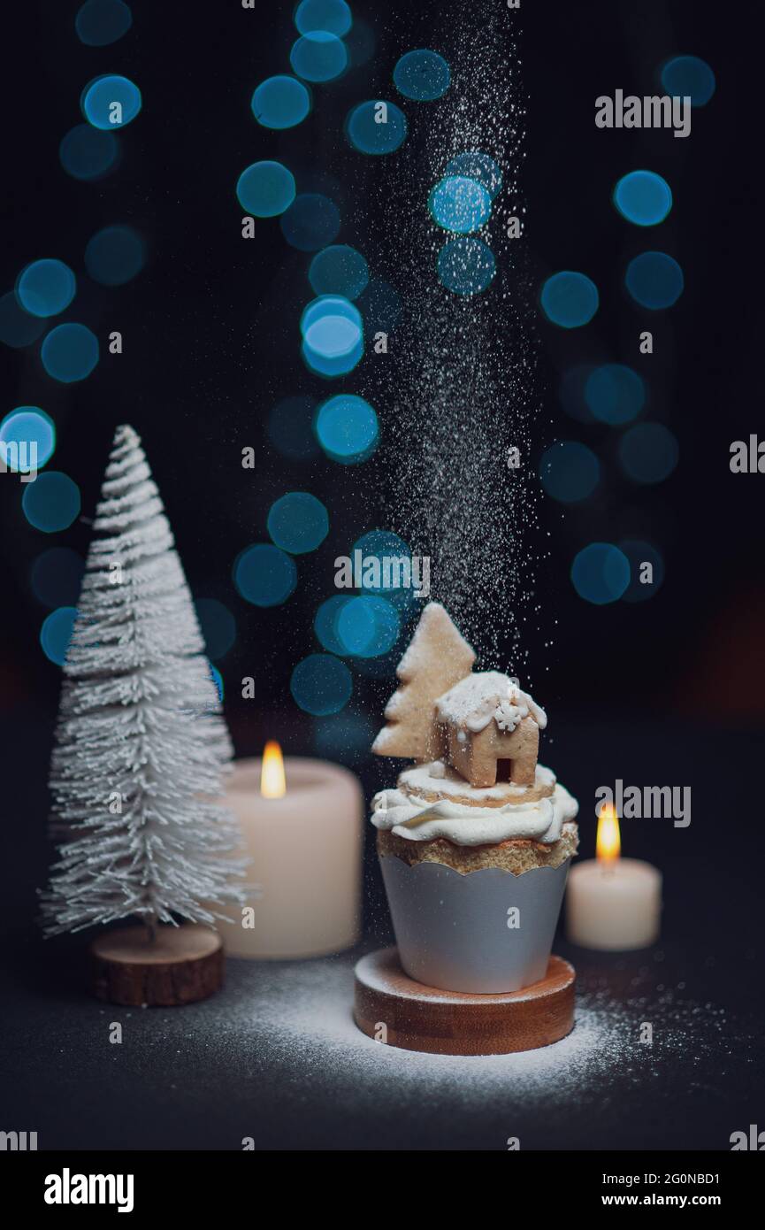 Vertical shot of a cupcake with Christmas decorations on a blurred ...