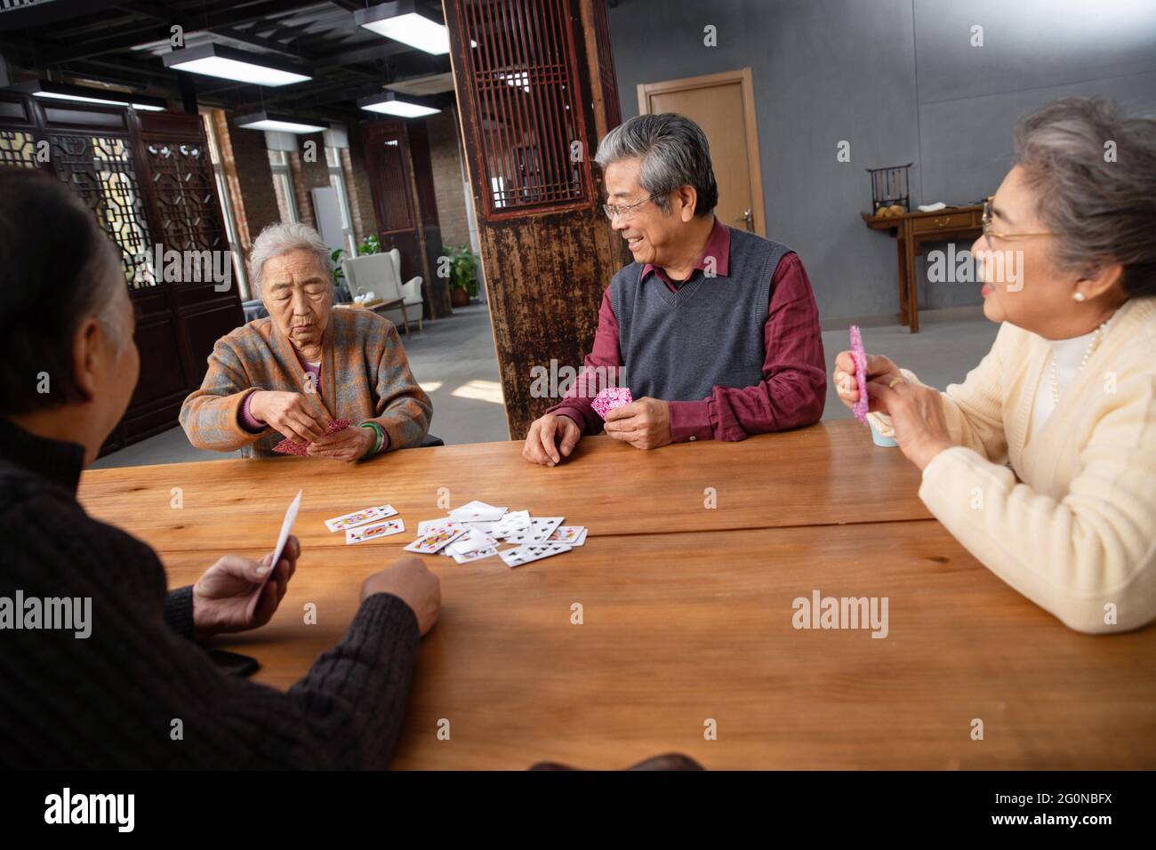 Old friends playing CARDS Stock Photo - Alamy