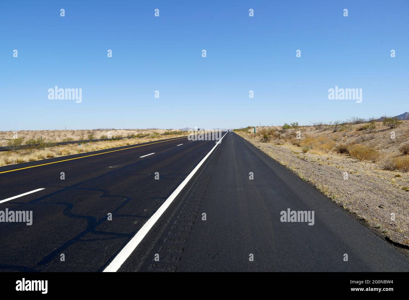 Asphalt Highway going through the Arizona Desert Stock Photo - Alamy