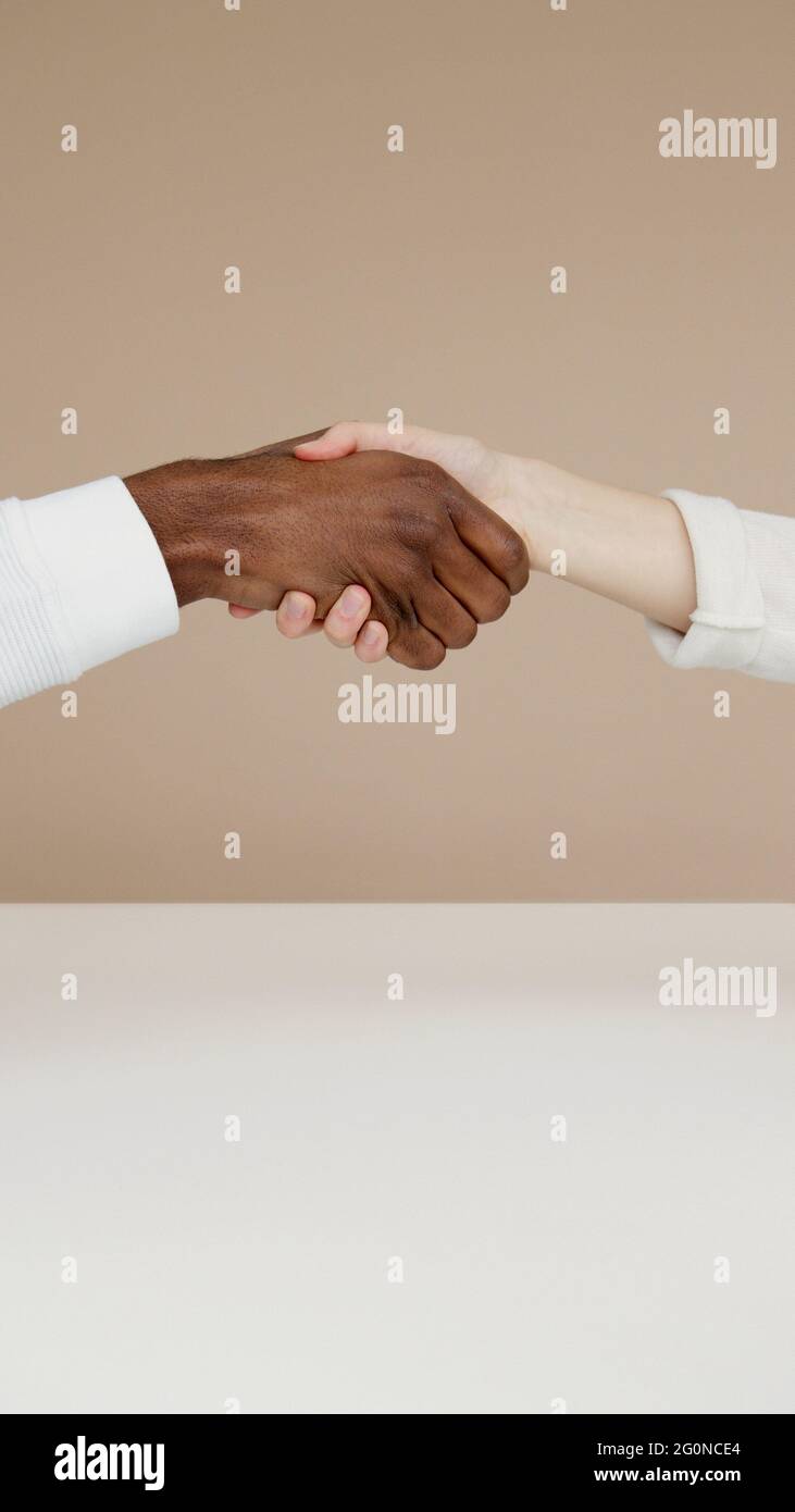 Congratulating hand shake hi-res stock photography and images - Alamy
