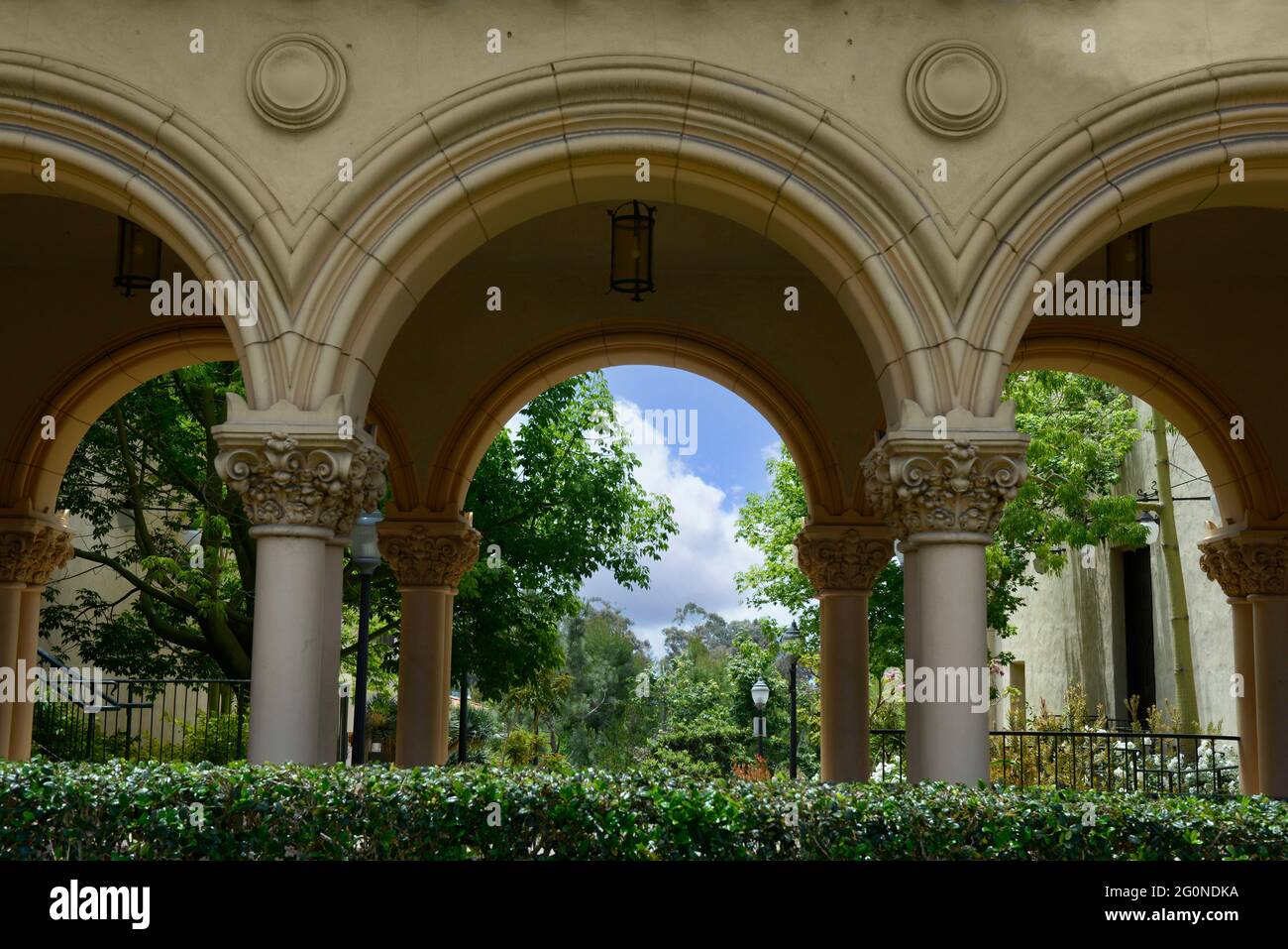 Looking through the spanish style architectural archways that span the ...