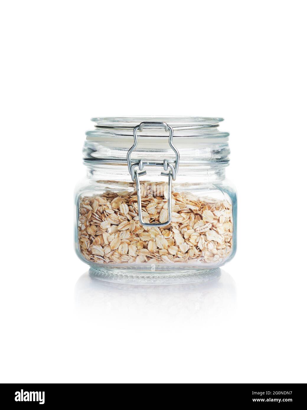 Rolled oats in glass jar isolated on a white background Stock Photo - Alamy