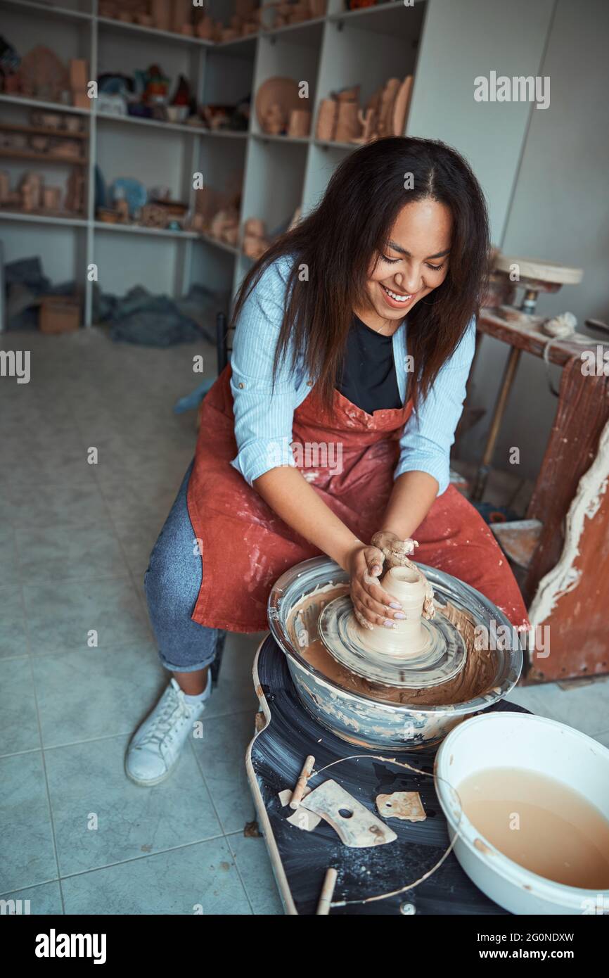 Joyful female ceramist making hi-res stock photography and images - Alamy