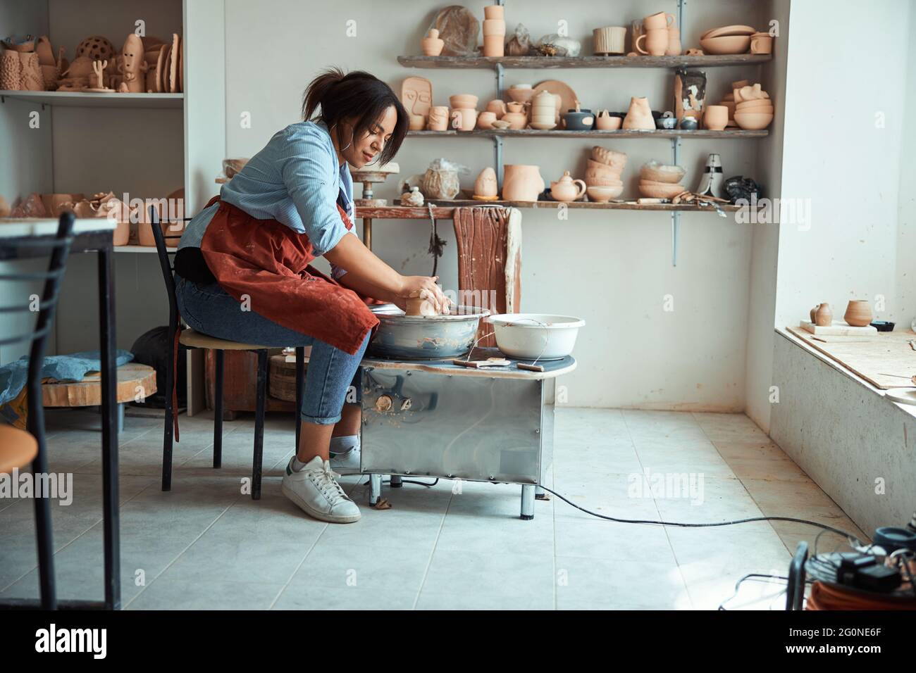 Charming female ceramist making hi-res stock photography and images - Alamy