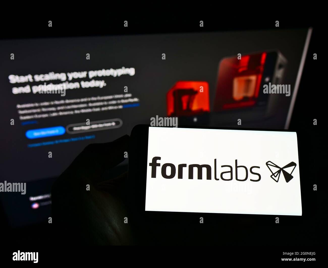 Person holding smartphone with logo of US 3D printing company Formlabs ...