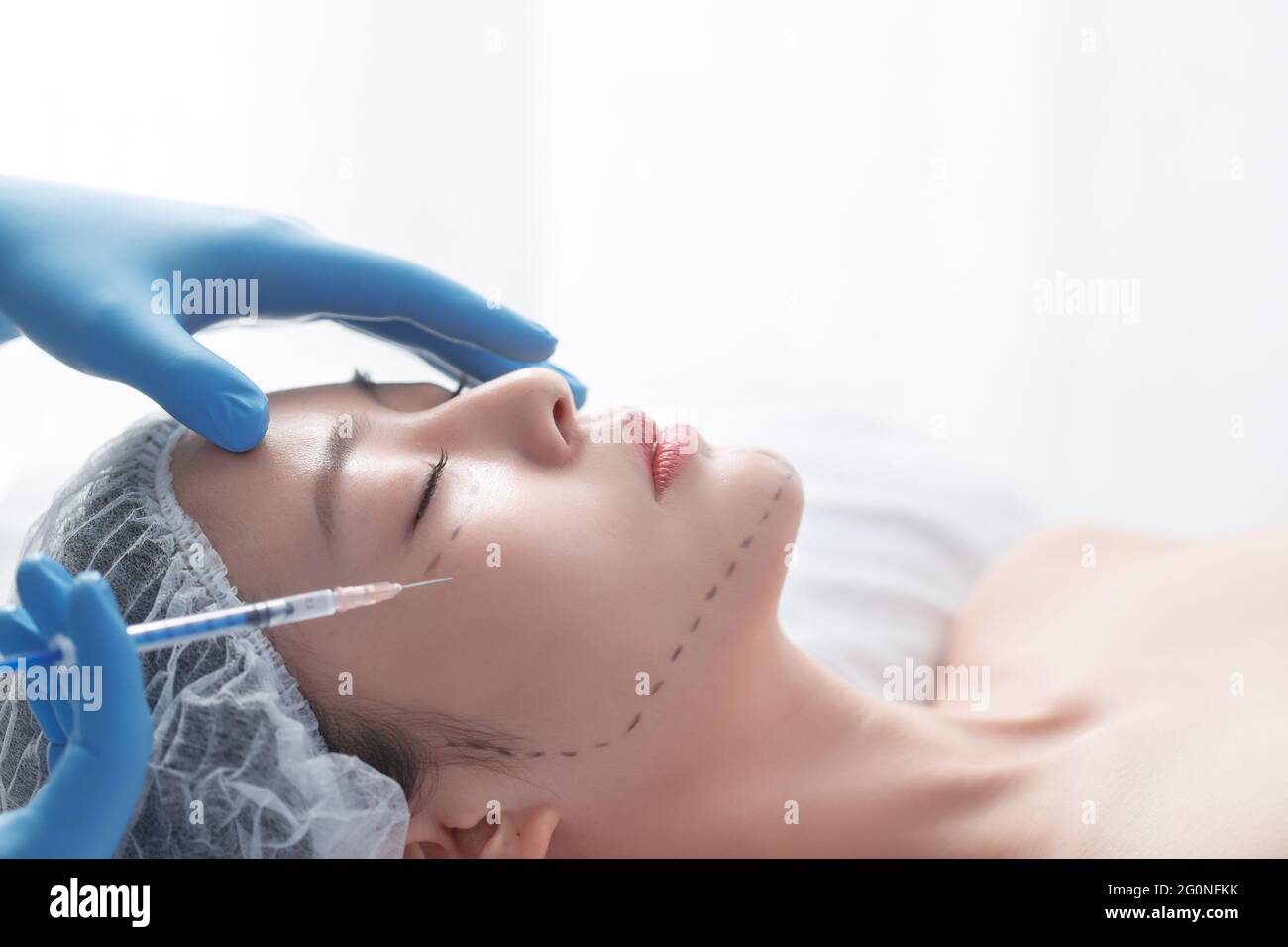 Do facial injections of young women Stock Photo - Alamy