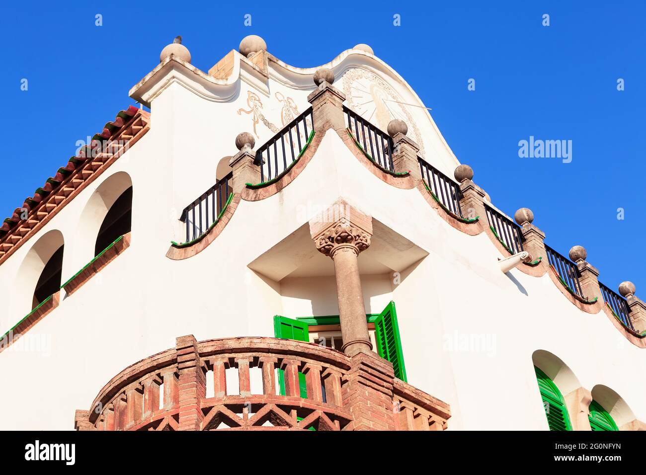 Traditional balcony in Catalan style . Spanish house with sundial Stock ...