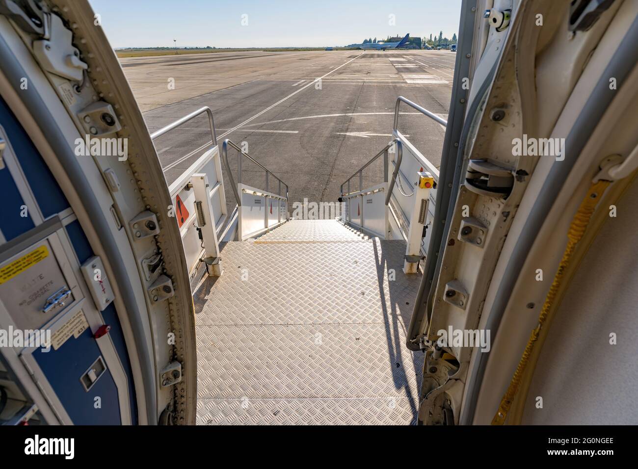 Airplane exit stairs and the clear runway Stock Photo - Alamy