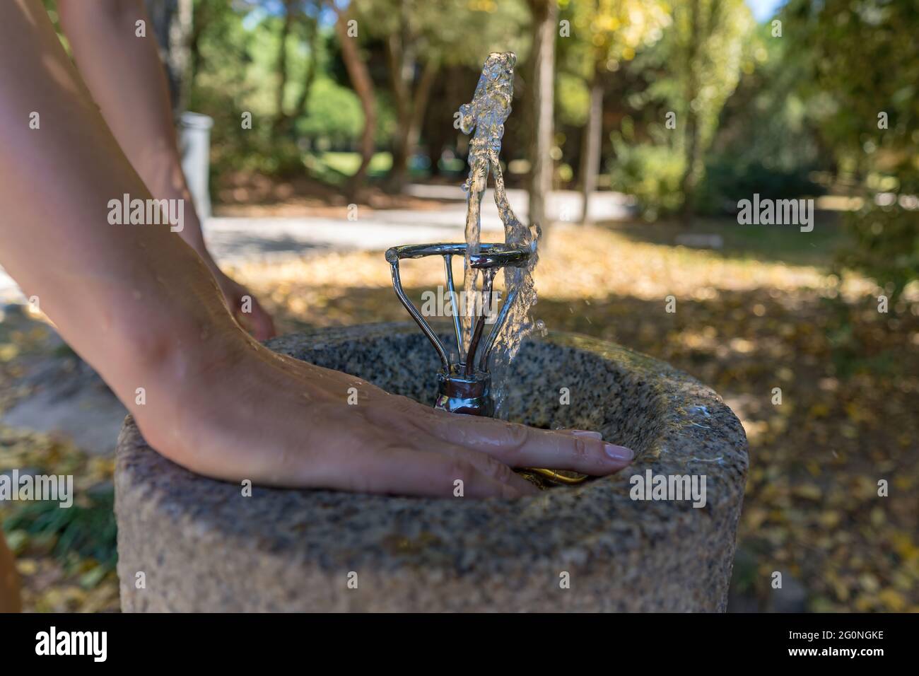 Drinking fountain in a public park throwing water Stock Photo - Alamy