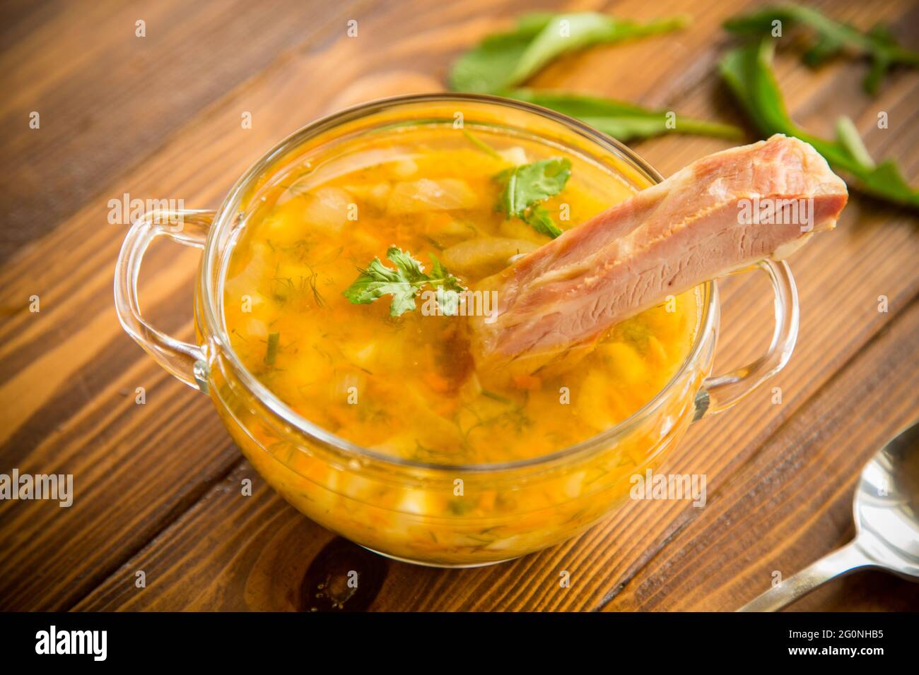 cooked pea soup with ribs smoked in a plate Stock Photo - Alamy