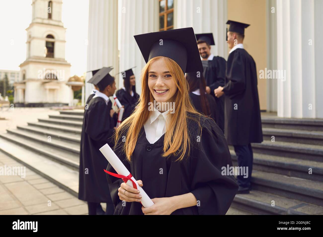 Graduation girl holding her diploma hi-res stock photography and images ...