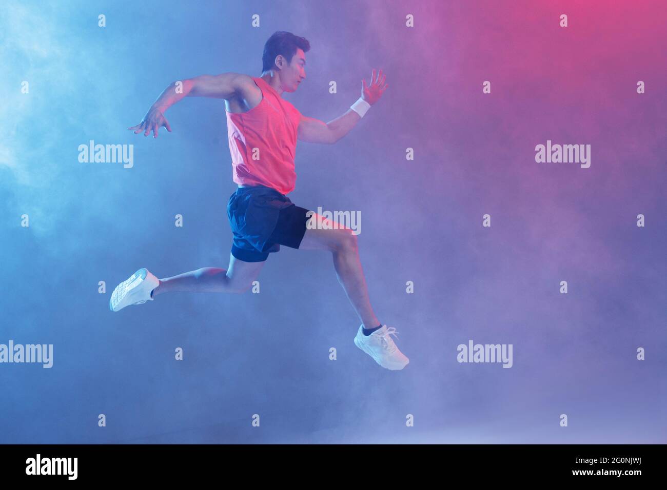Running jump athletes Stock Photo - Alamy
