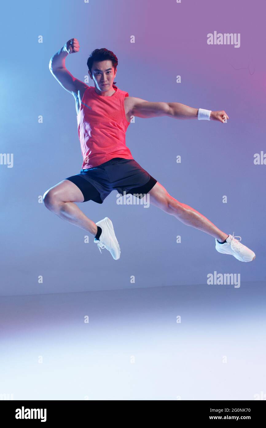 Running jump athletes Stock Photo - Alamy