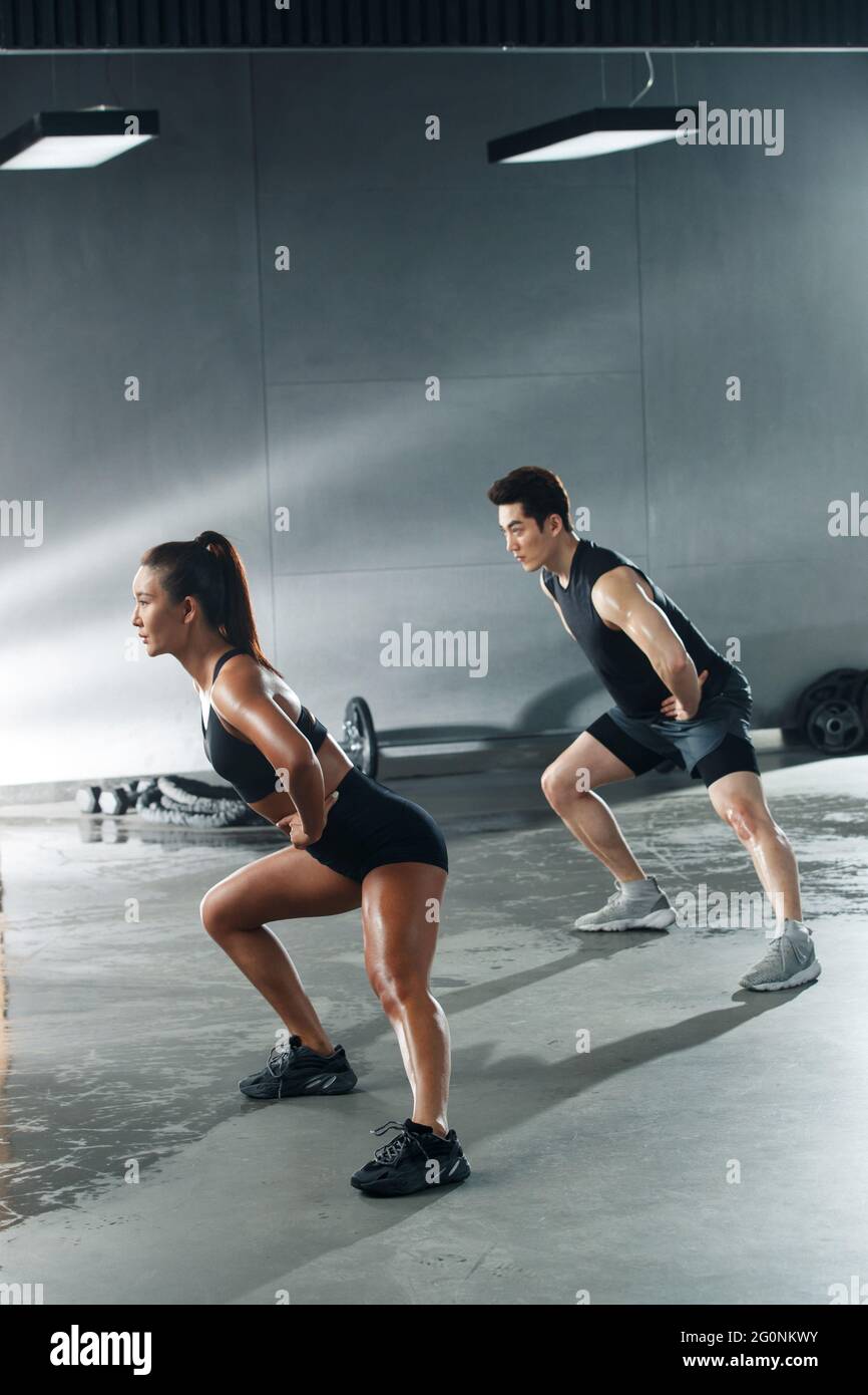 Young people exercise in the gym Stock Photo - Alamy