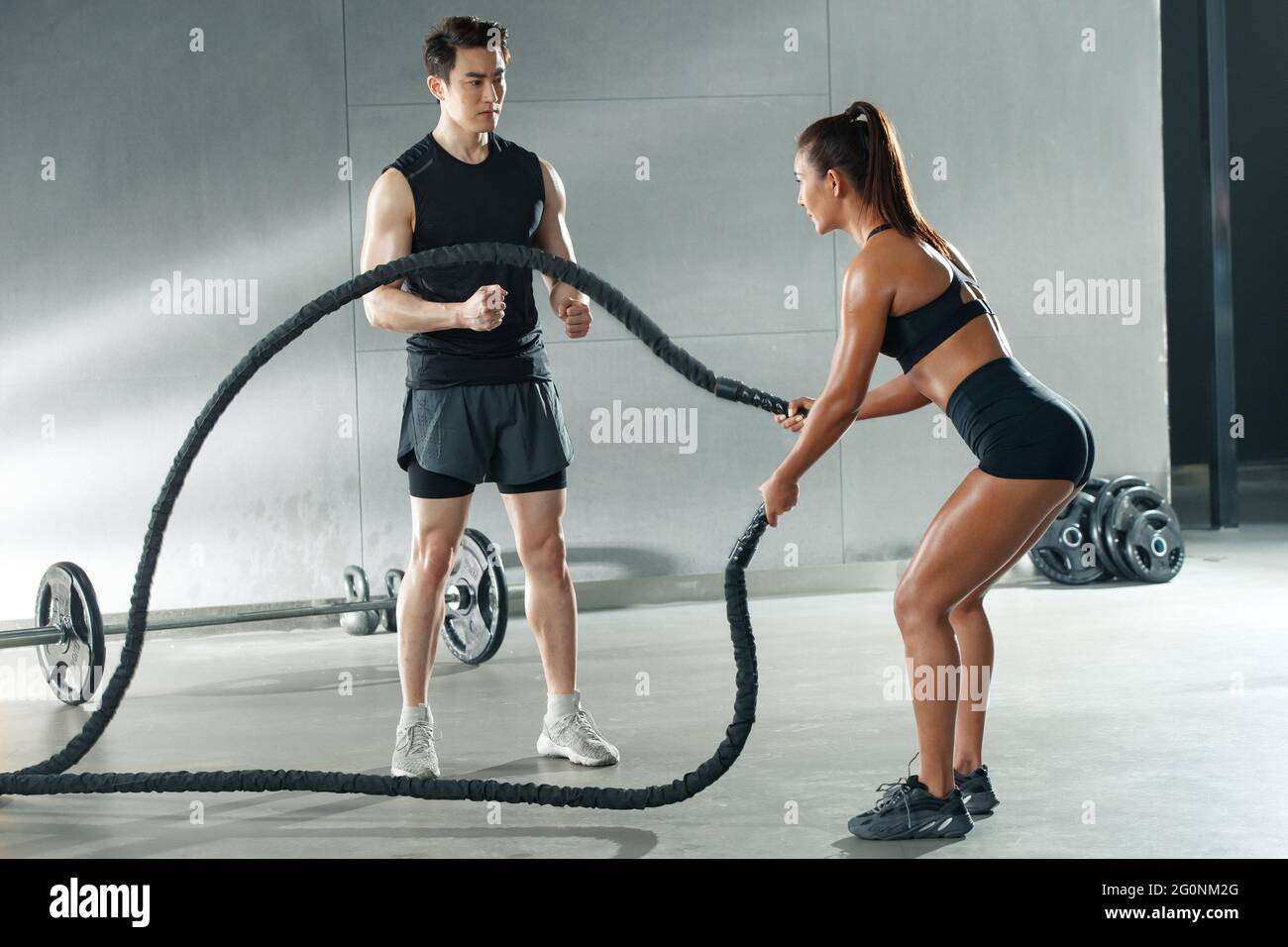 Fitness coaching young woman Stock Photo - Alamy