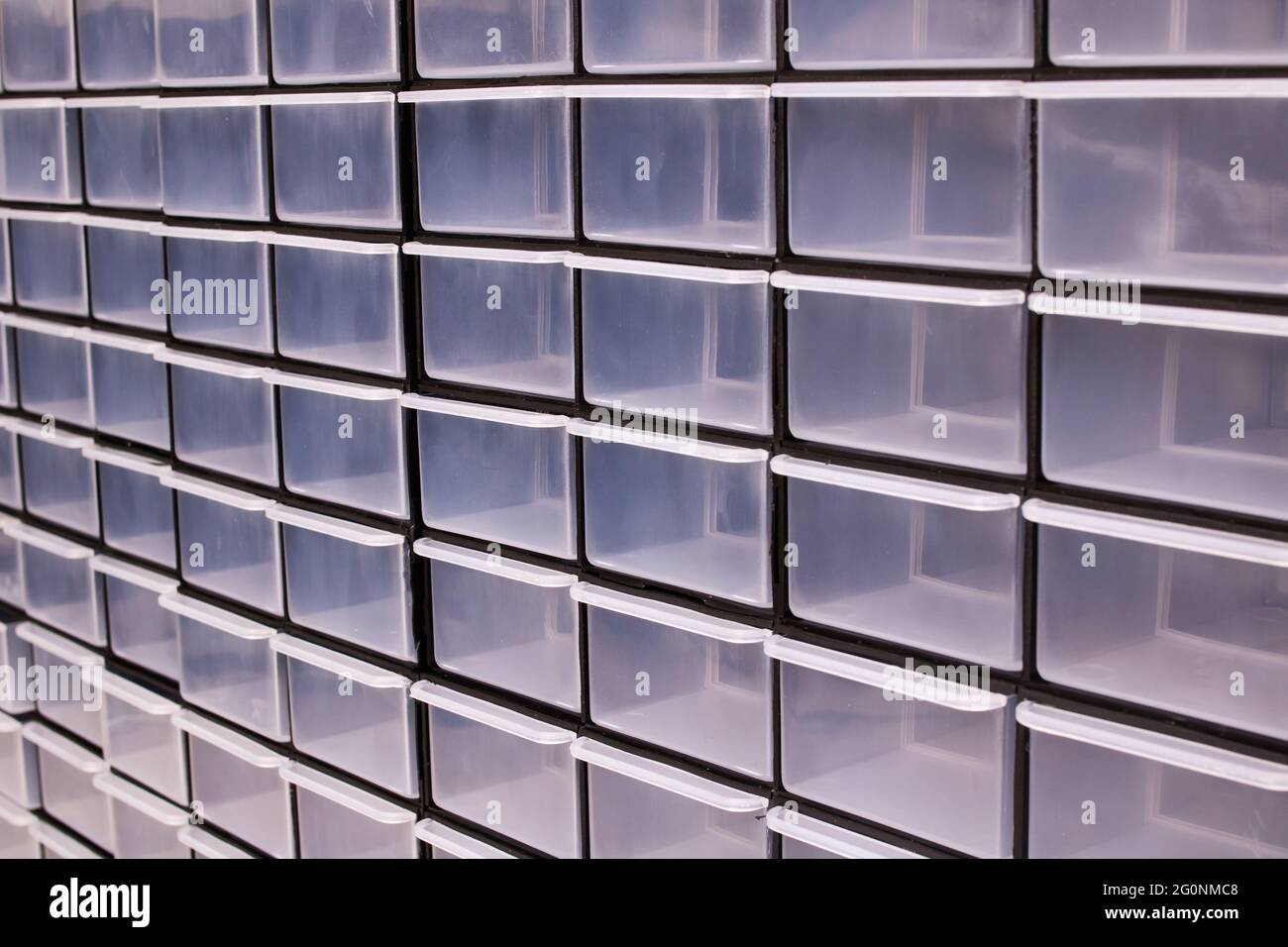 Plastic cells in the small change box close up Stock Photo - Alamy