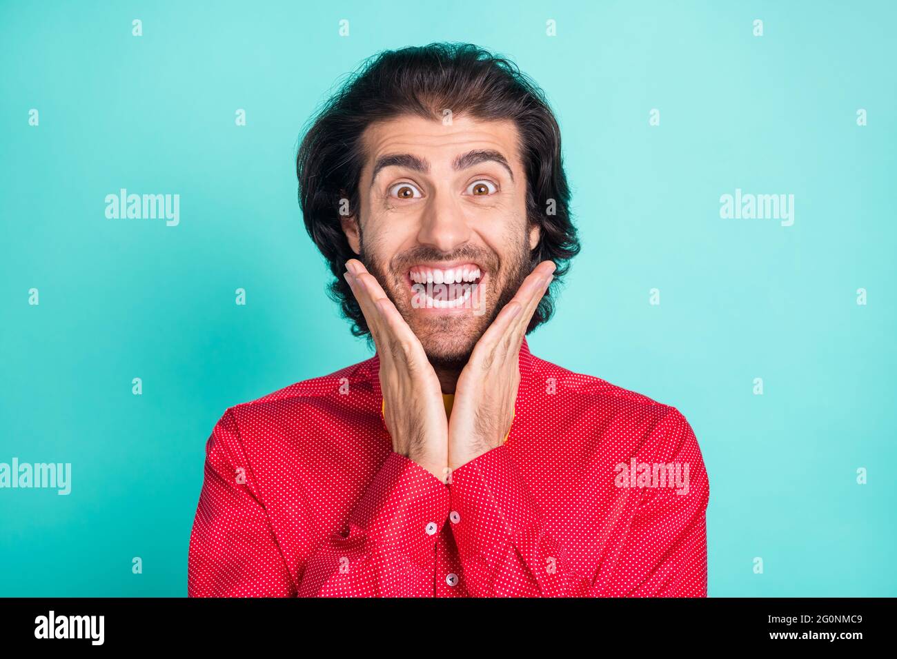Photo Of Young Crazy Smiling Cheerful Handsome Man Hold Hands Cheeks