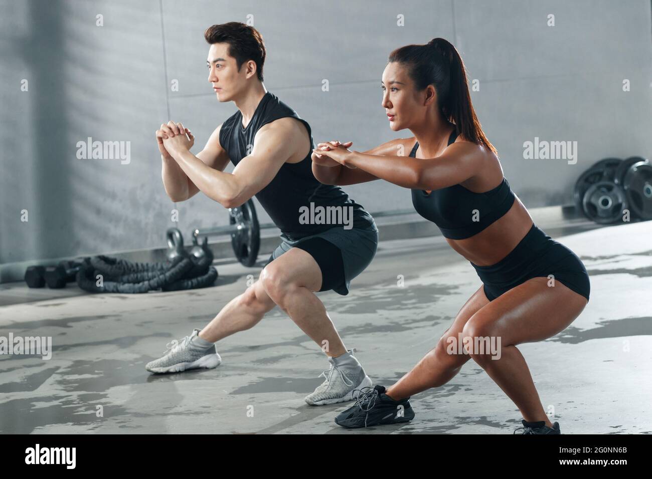 Young people exercise in the gym Stock Photo - Alamy