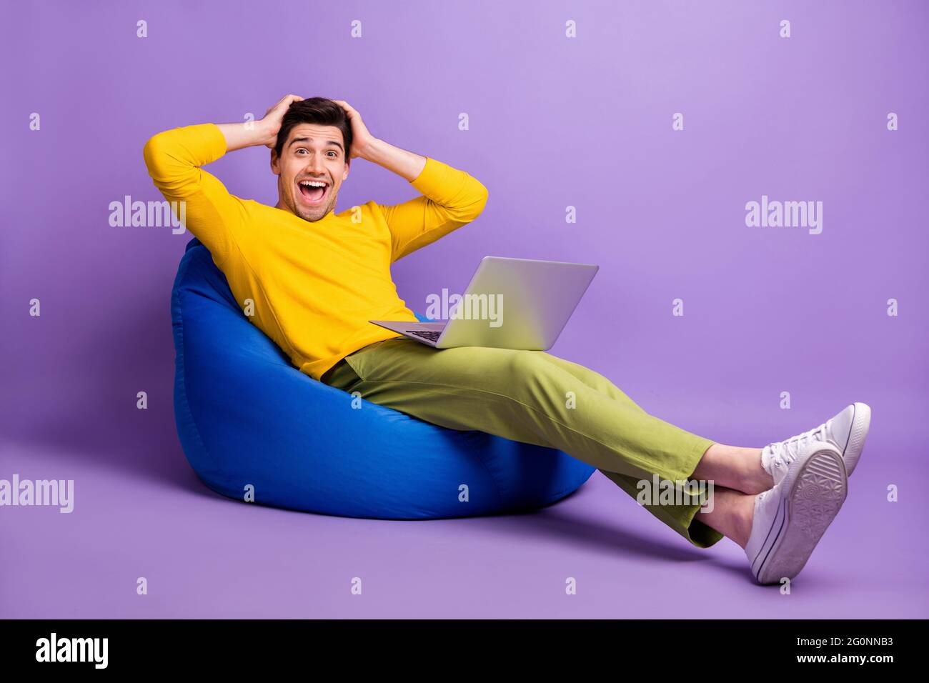 Full length profile portrait of impressed guy arms on head open mouth ...