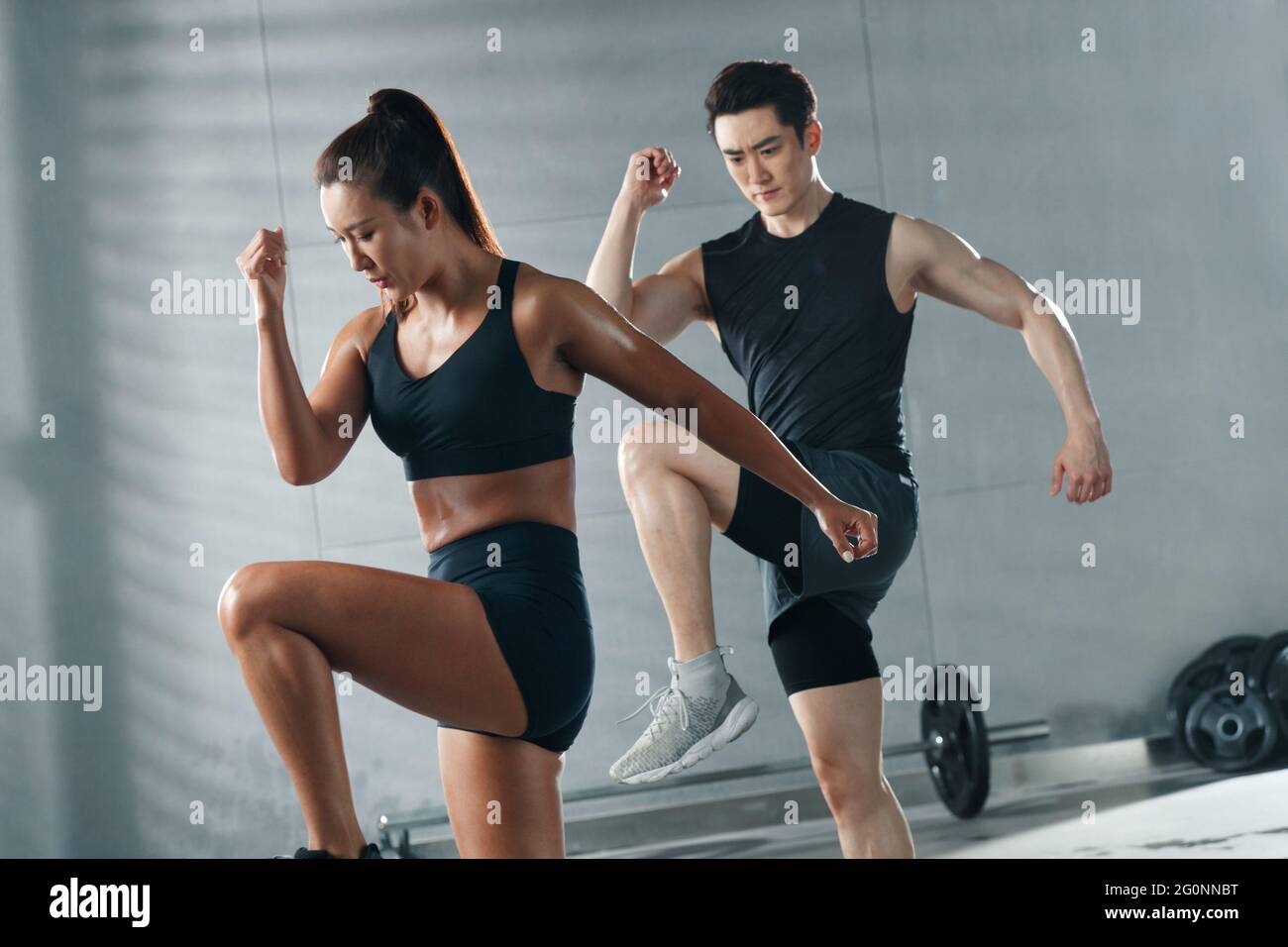 Young people exercise in the gym Stock Photo - Alamy