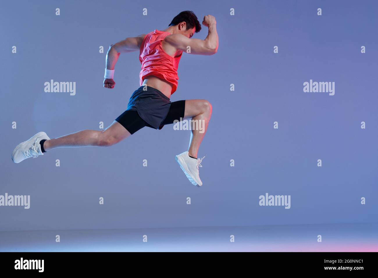 Running jump athletes Stock Photo - Alamy