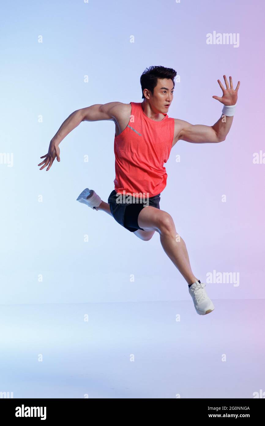 Running jump athletes Stock Photo - Alamy